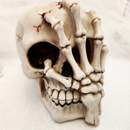 Skull with Skeleton Claw Hand – Inspire Me Online